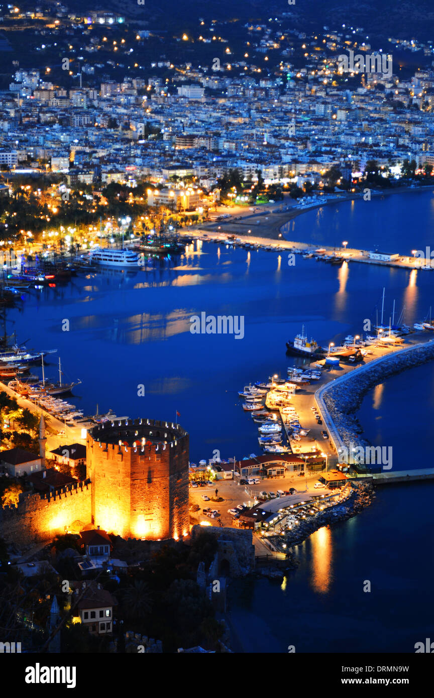 View of Alanya harbor from Alanya peninsula. Turkish Riviera by night ...