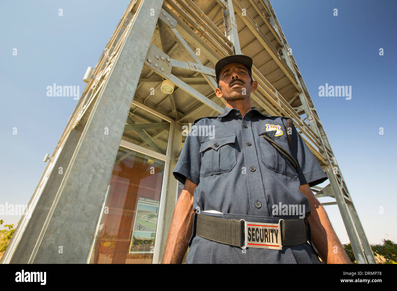 A security guard below the viewing tower of Asia's largest solar popwer ...