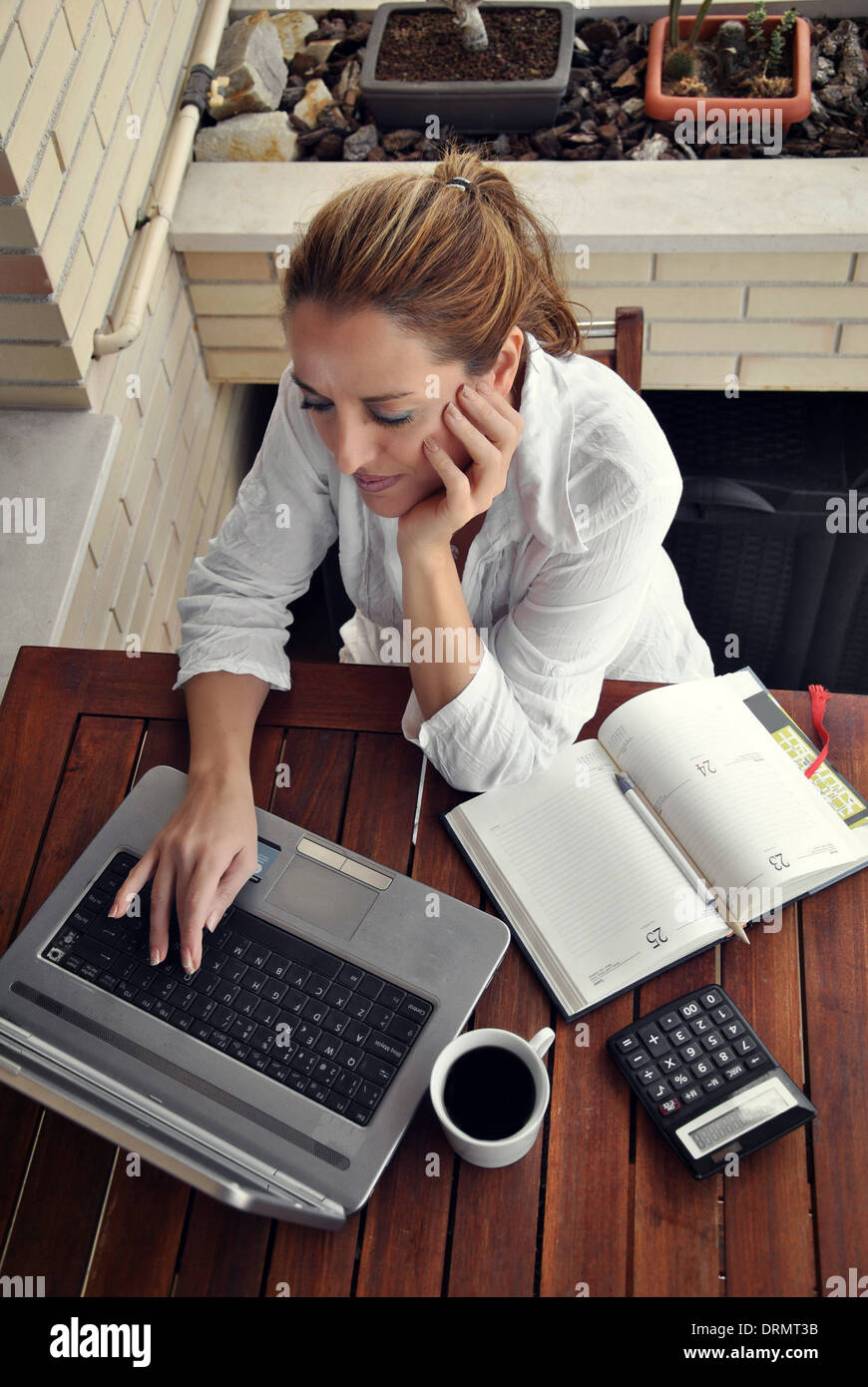 woman working quietly on your terrace with a coffee Stock Photo - Alamy