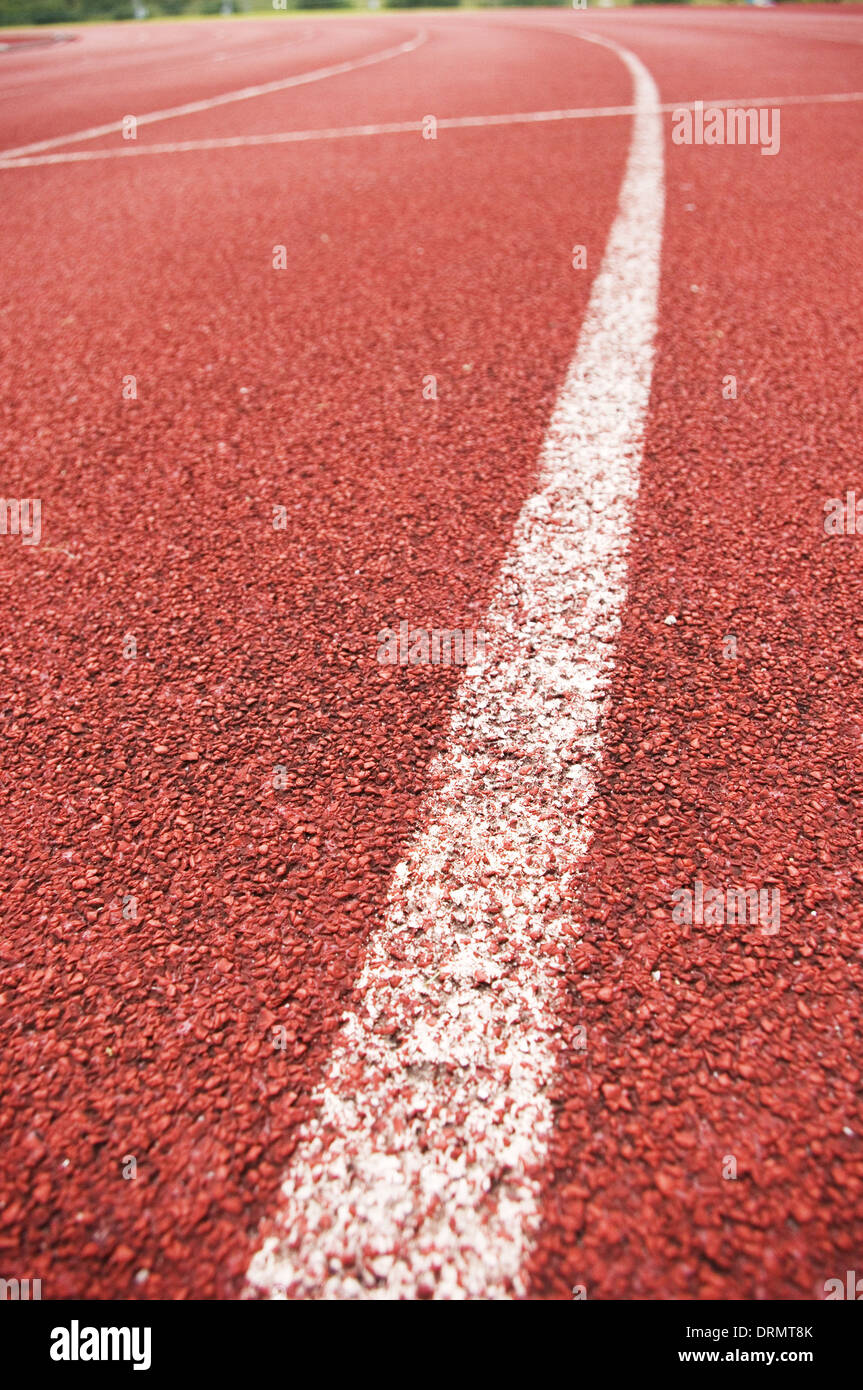 a close up of white line on red racetrack Stock Photo - Alamy