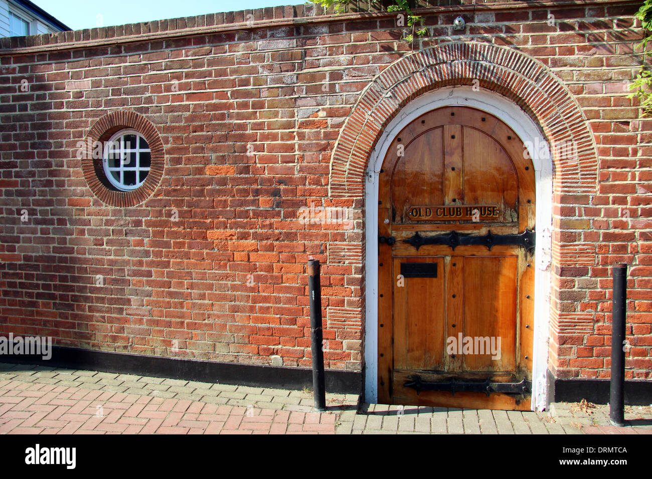 A wooden door and circular window in the old yacht clubhouse in Burnham ...