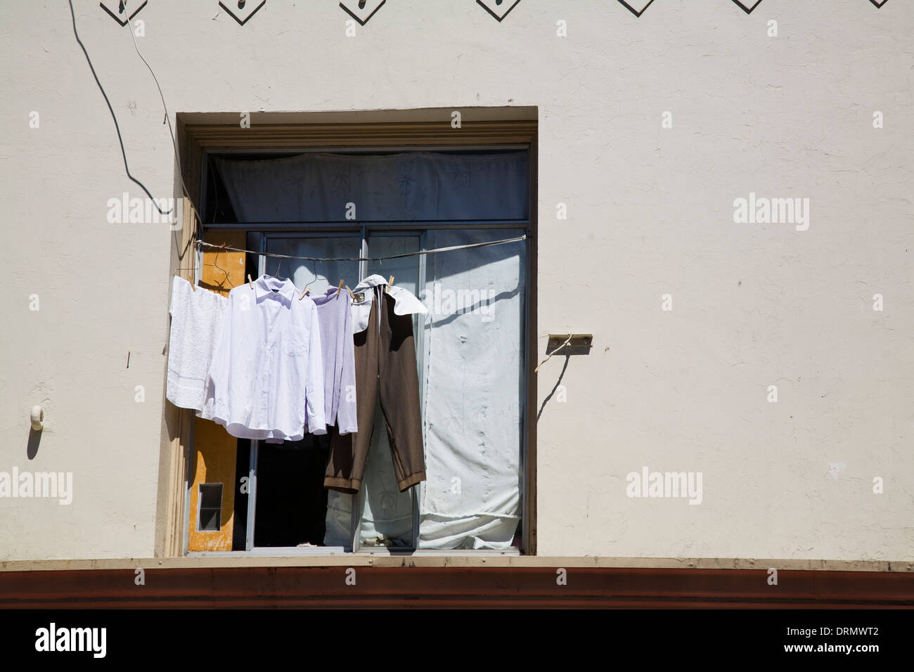 Clothes on line outside window Stock Photo - Alamy