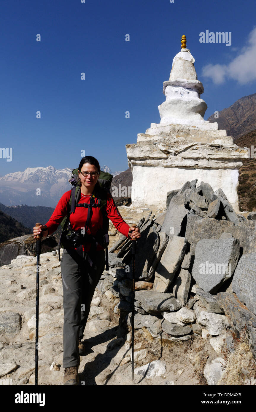 A lady trekker passes a stupa on the Everest Base Camp trek Stock Photo ...