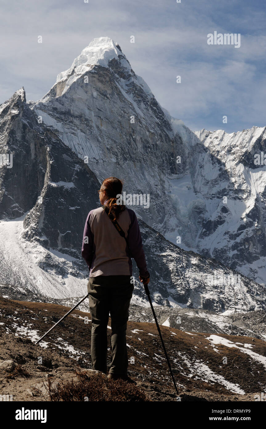 A lady trekker admires Ama Dablam on the Everest Base Camp trek Stock ...