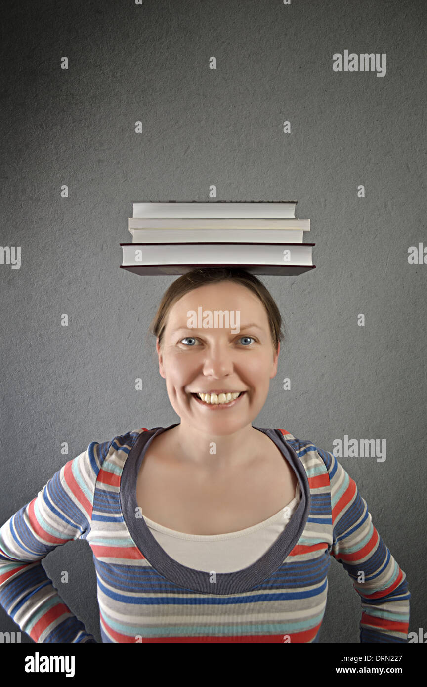 Girl balancing book on head hi-res stock photography and images - Alamy