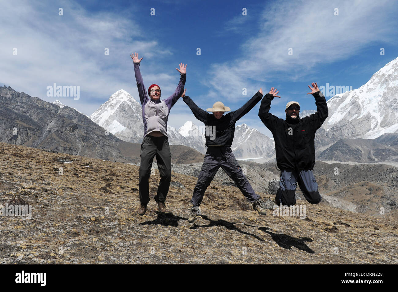 Three trekkers jumping for joy on the everest base camp trek Stock ...