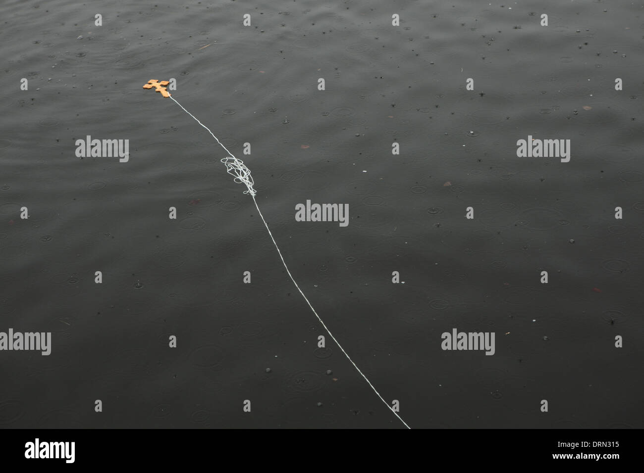 An Orthodox cross floats in the Vltava River after the ceremony of ...