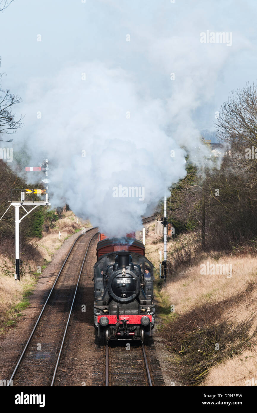 Looking down onto a steam loco heading a demonstration freight train ...