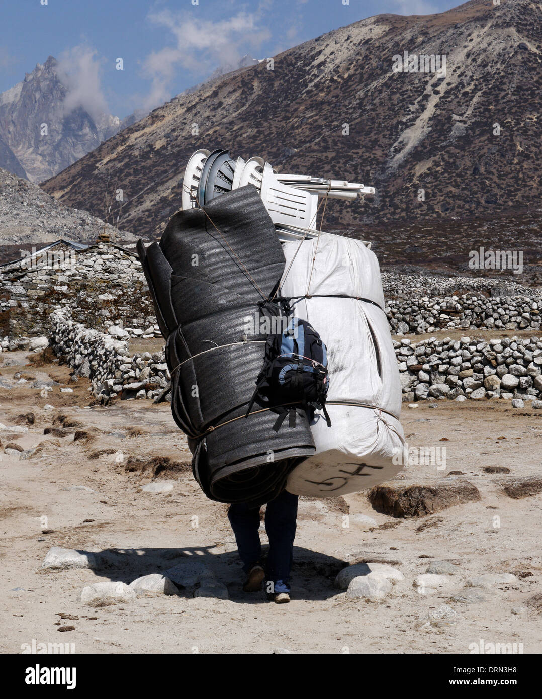 Porter carrying heavy load hi-res stock photography and images - Alamy