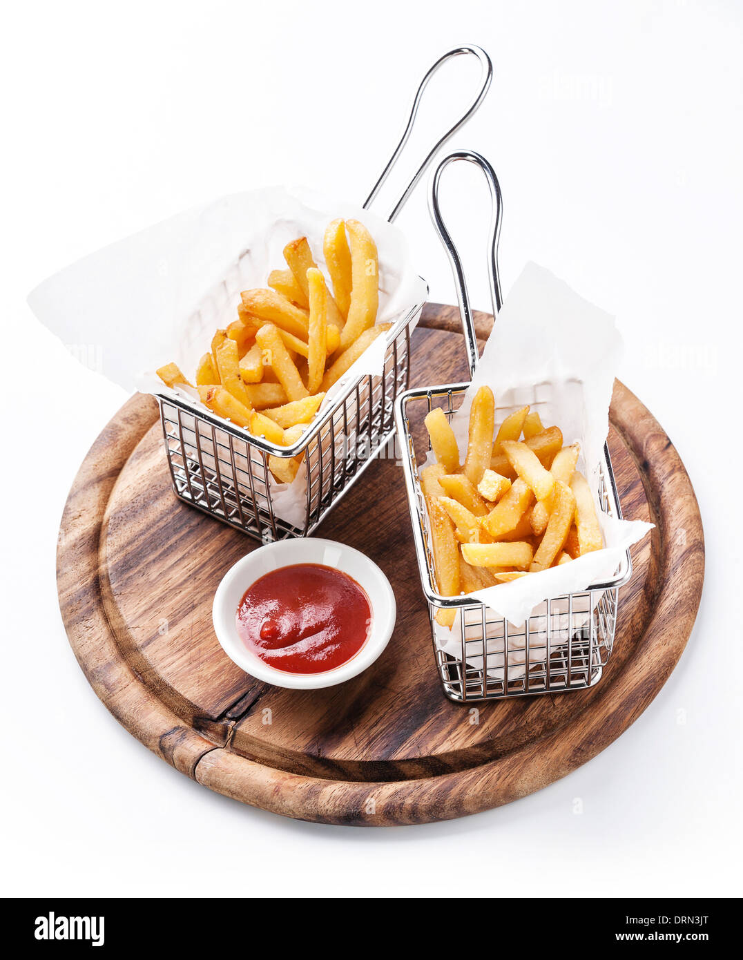 French fries in baskets for serving on white background Stock Photo - Alamy