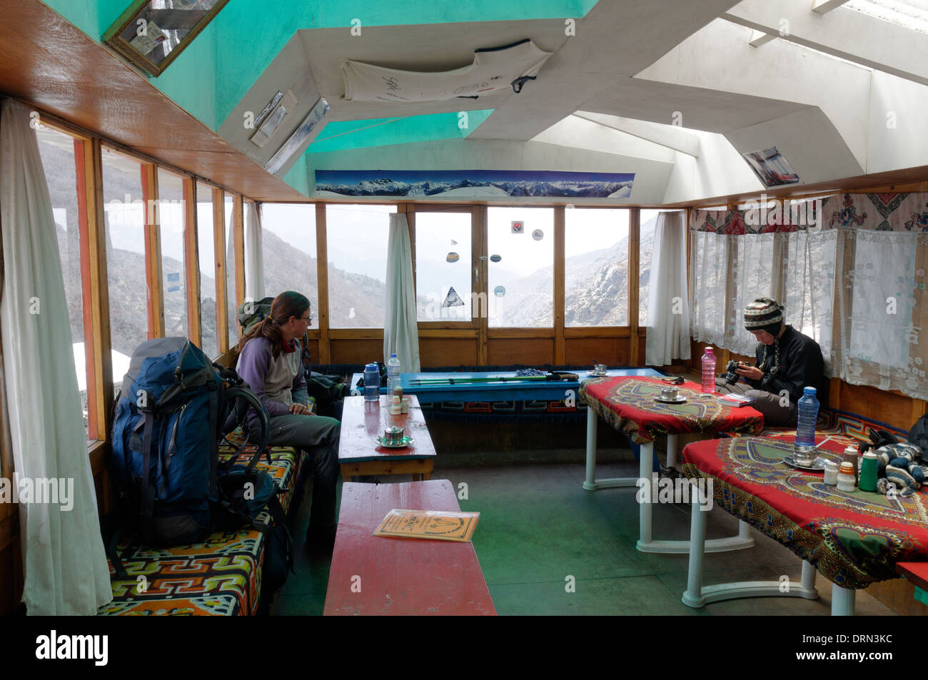 Two women inside a tea house on the everest base camp trek Stock Photo ...