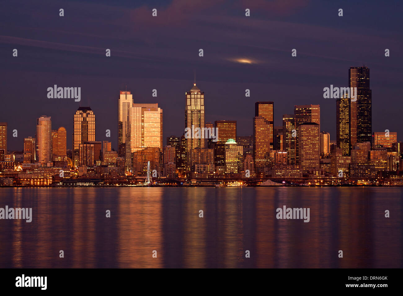 WASHINGTON - Moon peaking over the clouds on downtown Seattle and ...