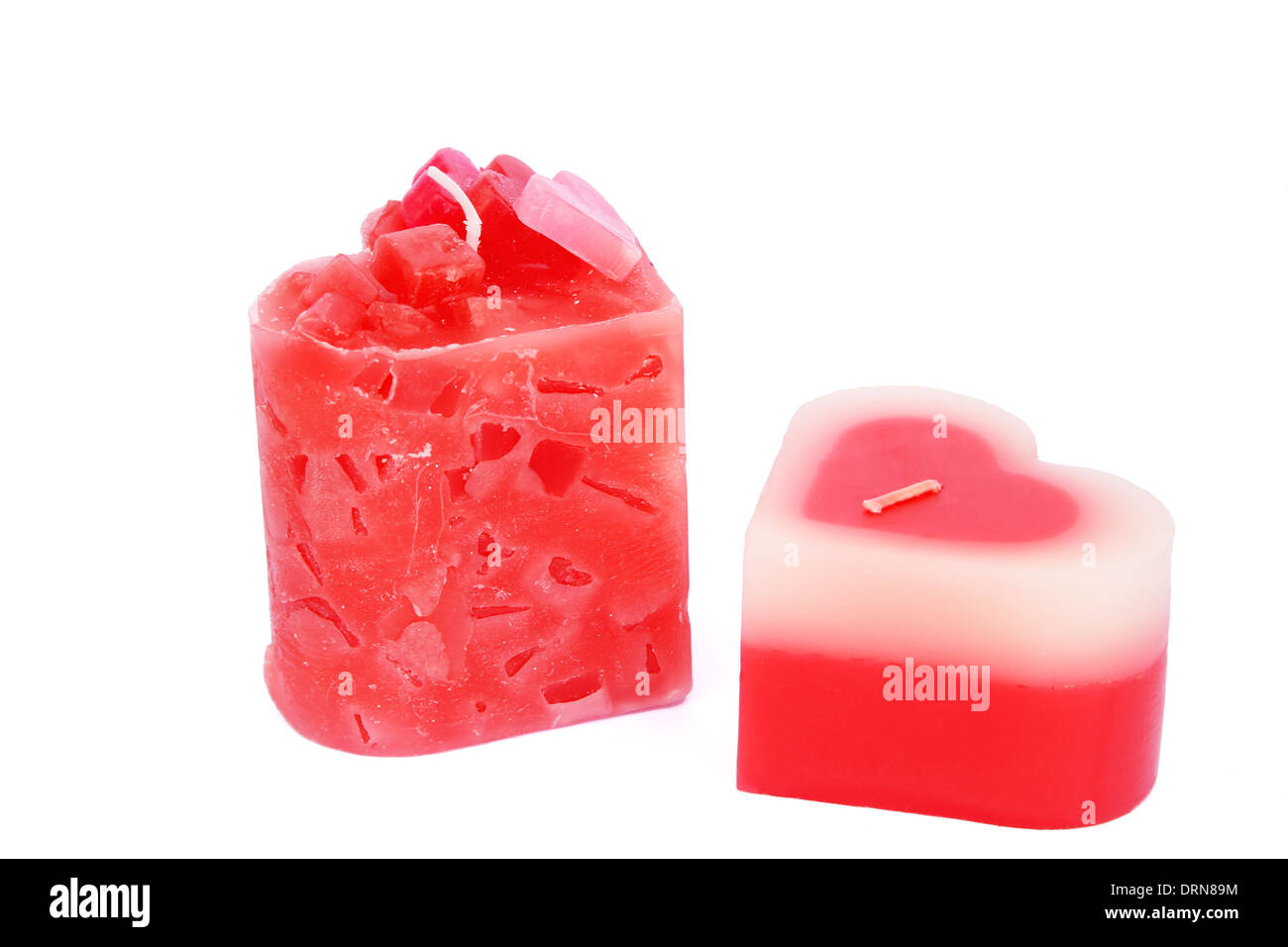 Heart shape red candles isolated on white background Stock Photo - Alamy