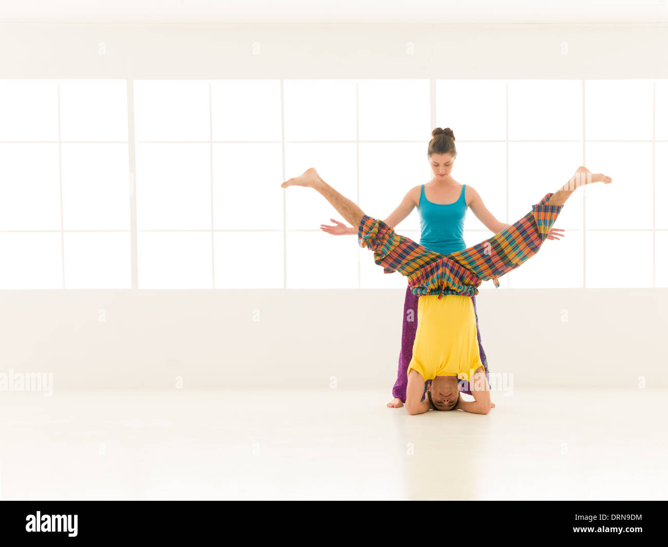 beautiful woman instructor with a handsome man dressed in vibrant ...