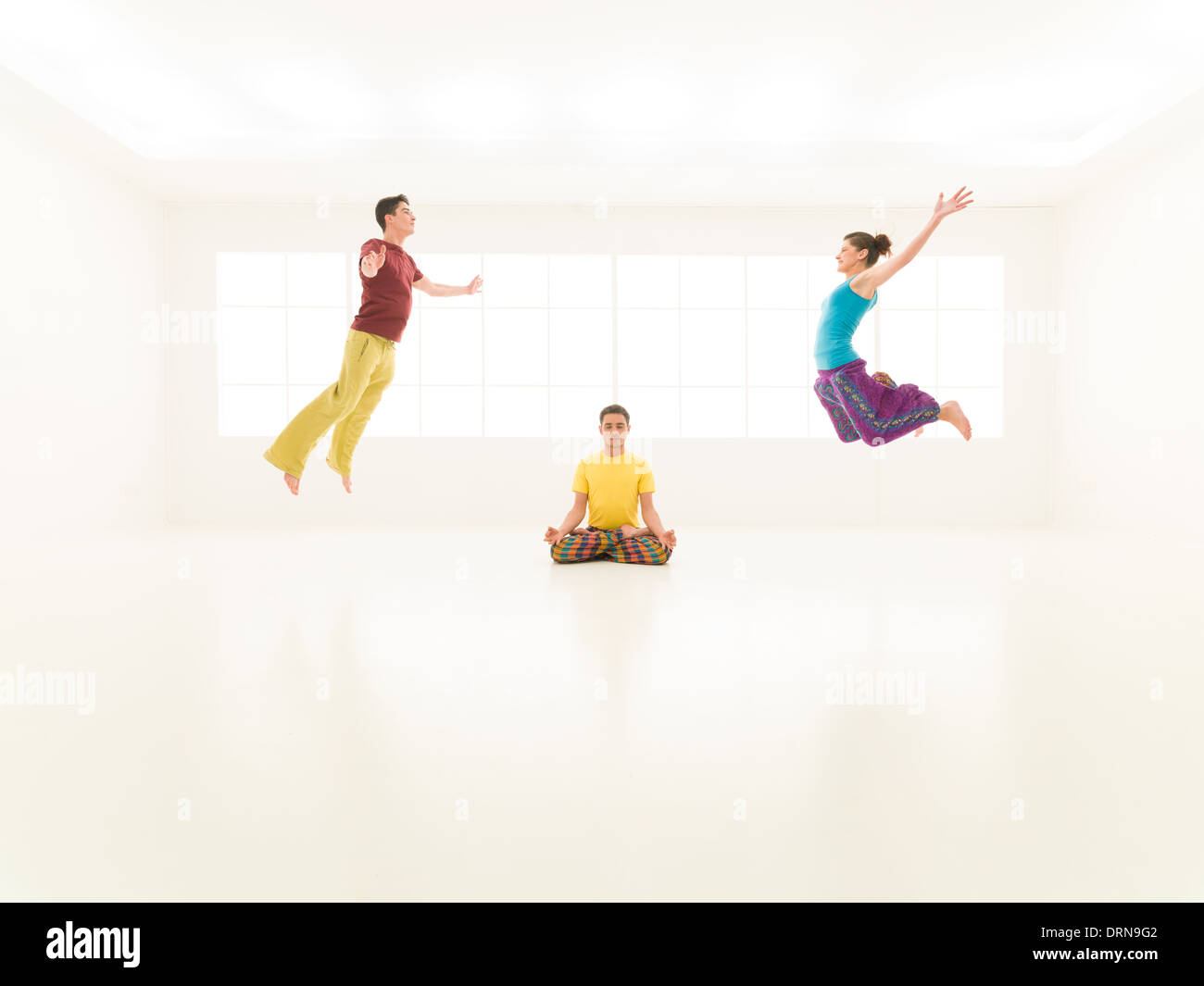 colorful young people are freestyling in stydio white background glass ...