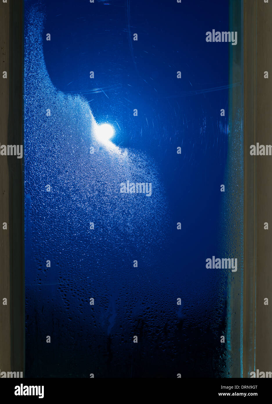 Moonlight through the window. Sweaty glass Stock Photo - Alamy