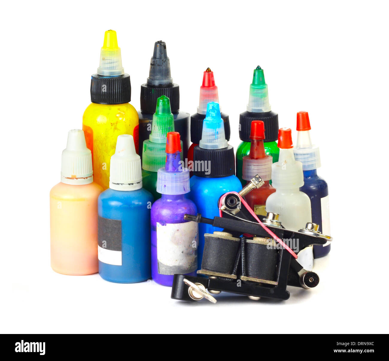 Tattoo machine with many color ink bottles isolated white background ...