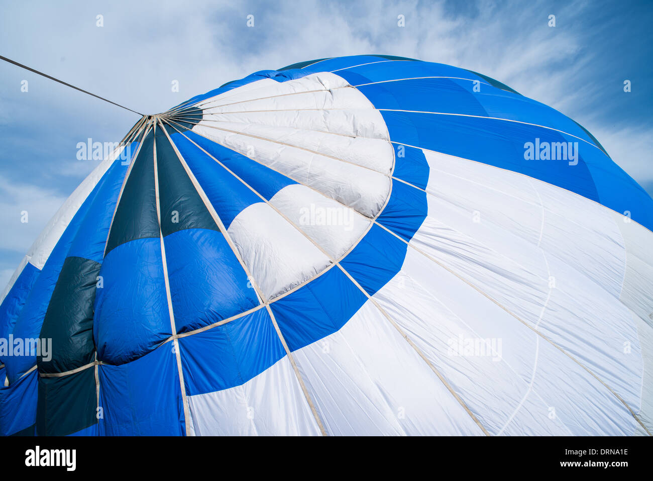 Blue Balloon in the blue cloudy sky Stock Photo - Alamy