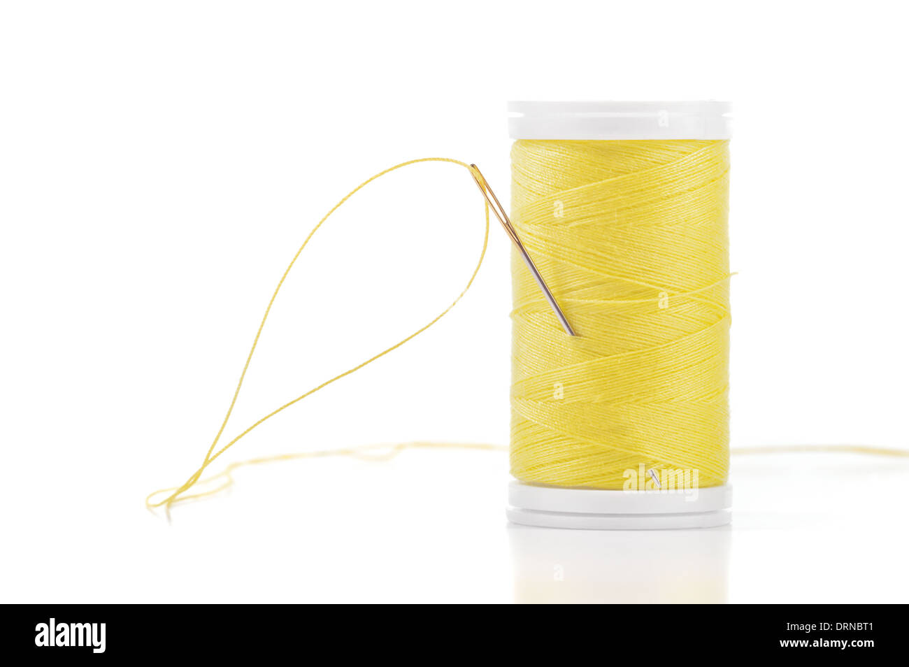 Yellow thread and one needle isolated on white background Stock Photo ...