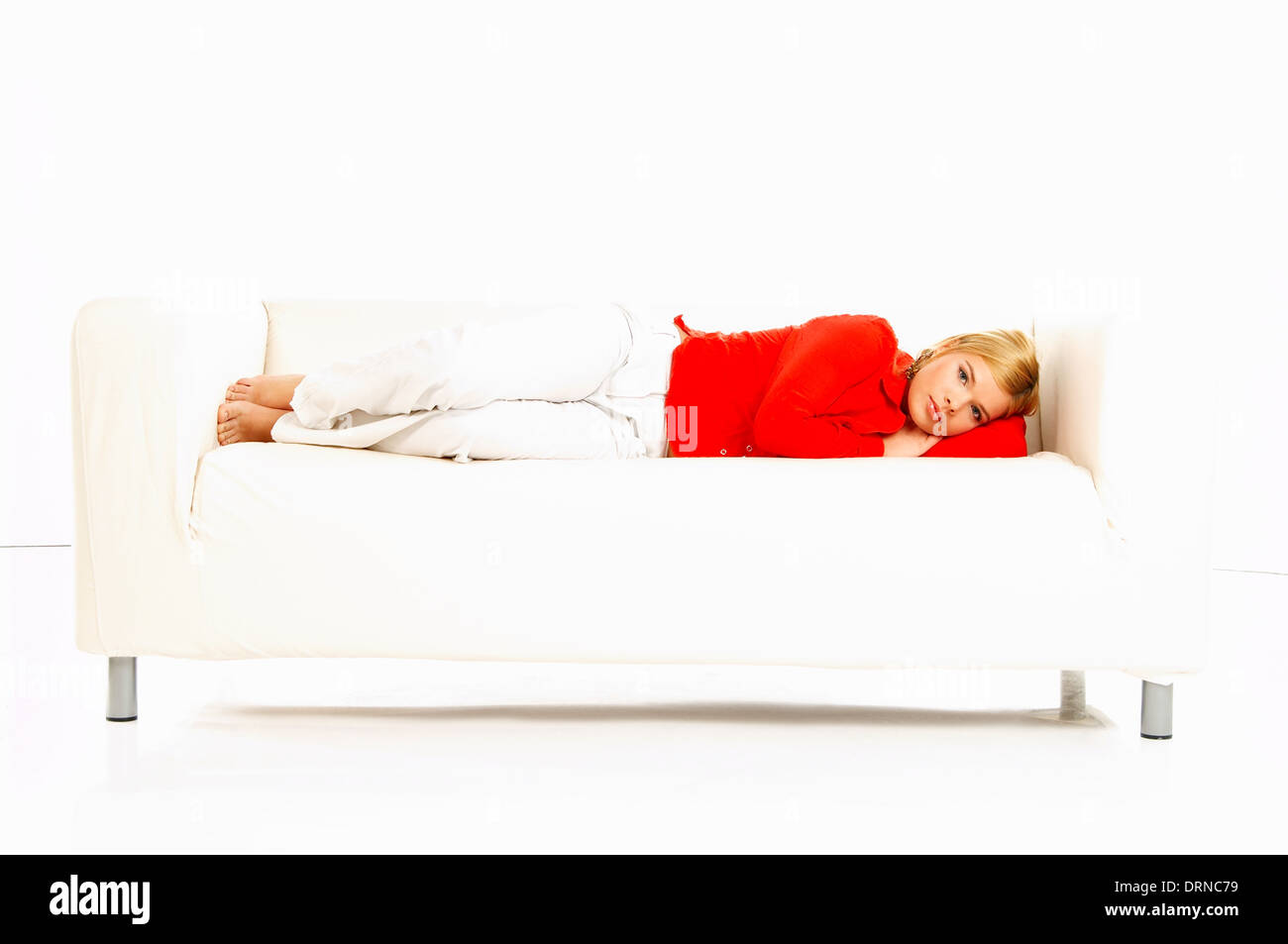 Women on couch Stock Photo - Alamy