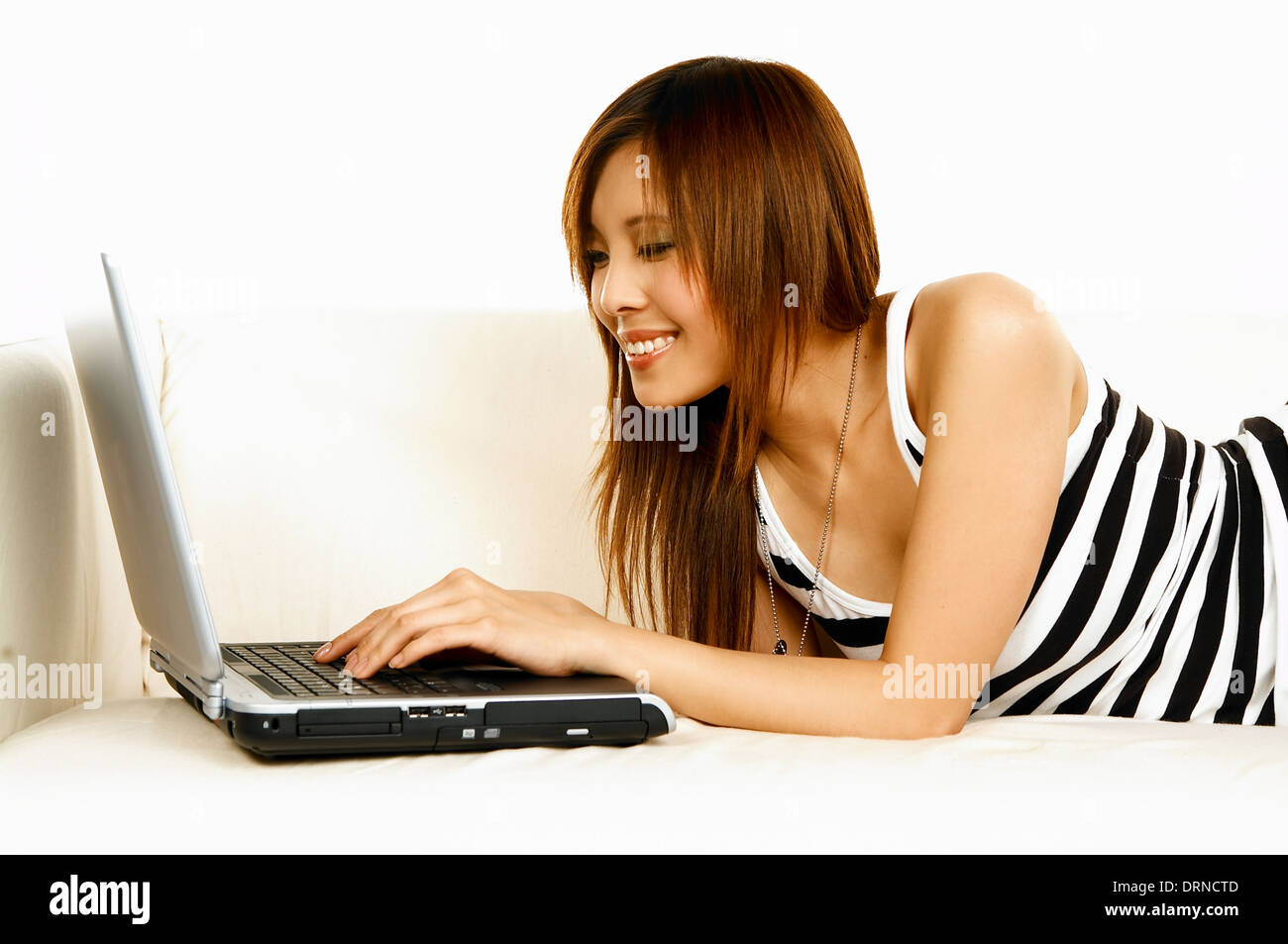 Asian girl with laptop Stock Photo - Alamy