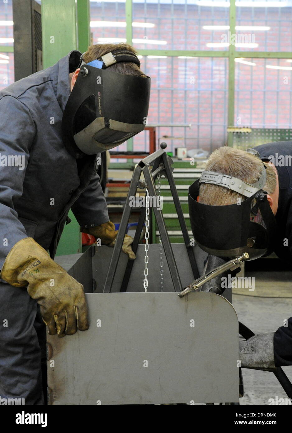 Neumuenster, Germany. 22nd Jan, 2014. Prison inmates work in a metal ...