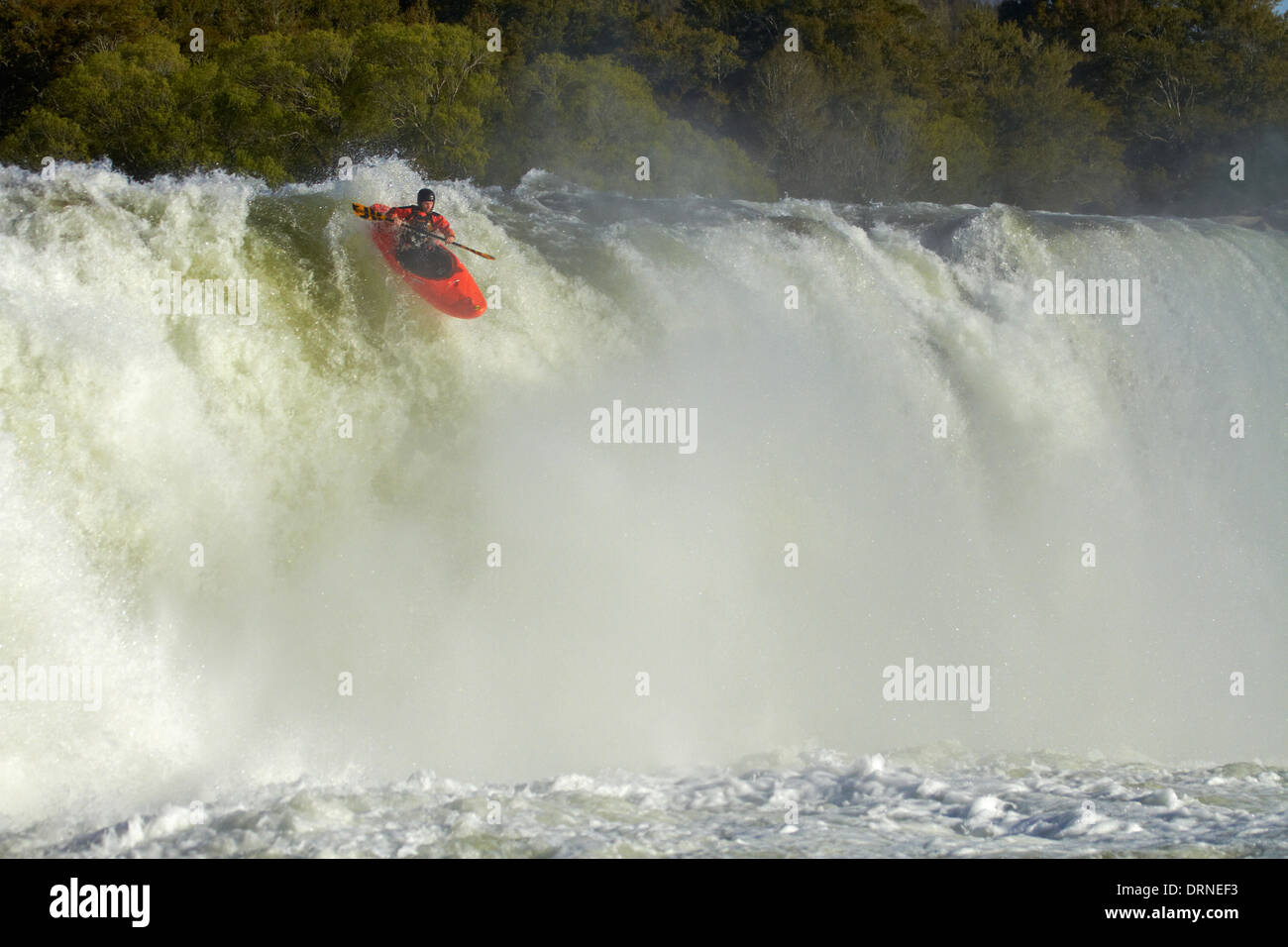Whitewater kayaker going over Maruia Falls, near Murchison, Tasman ...