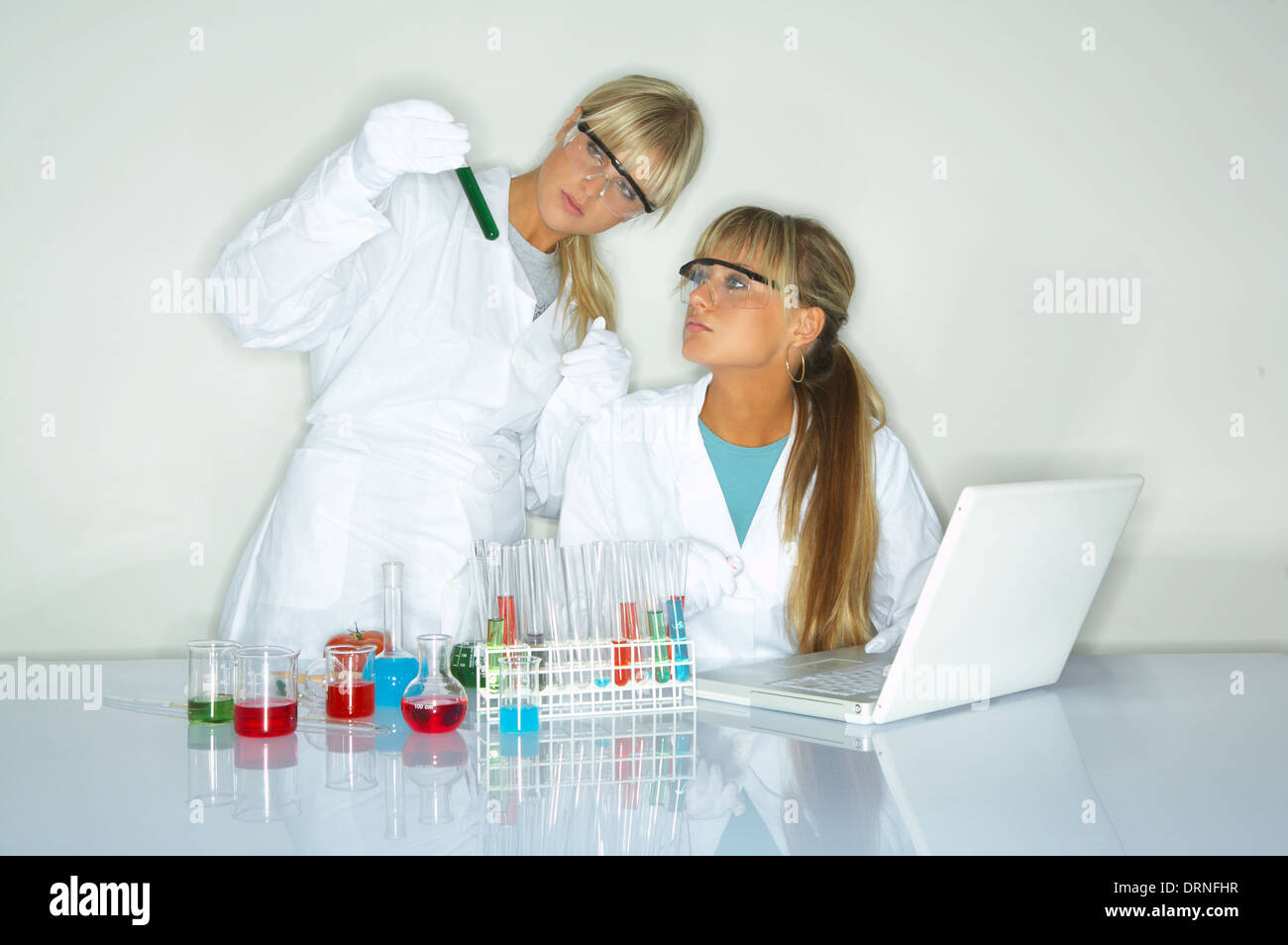 Female worker testing laptop hi-res stock photography and images - Alamy