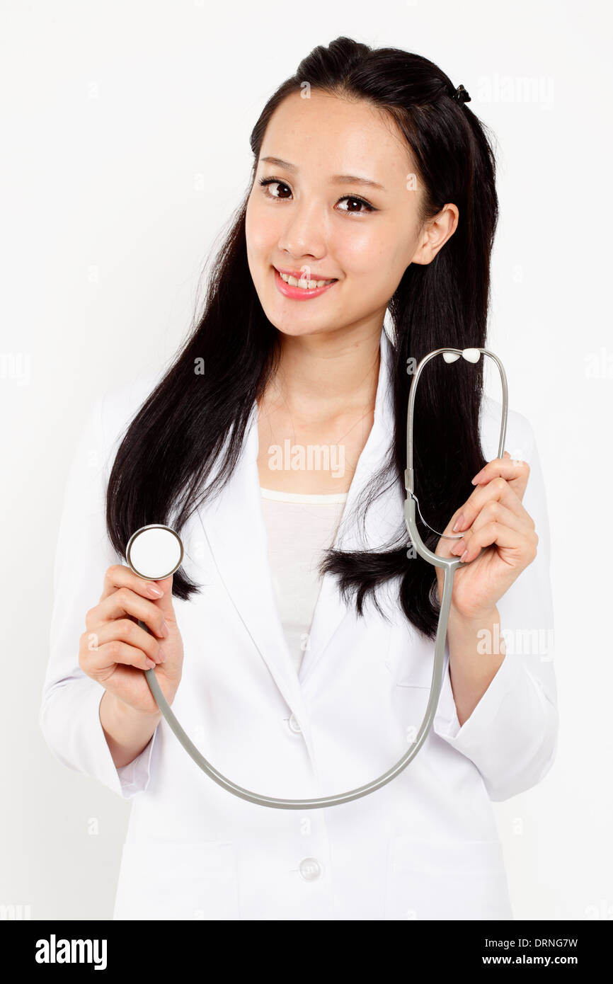 Female doctor takes stethoscope Stock Photo - Alamy