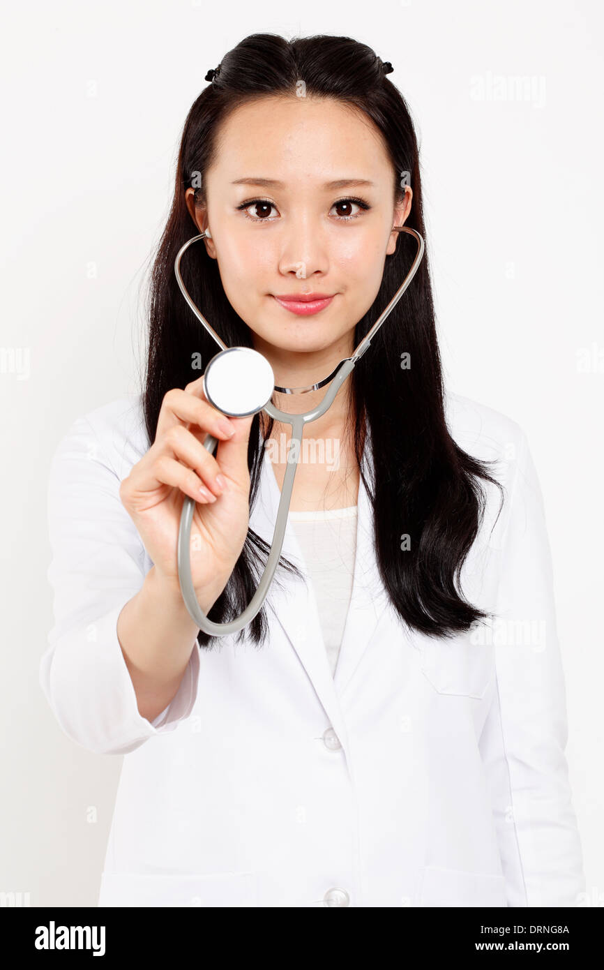 Female doctor takes stethoscope Stock Photo - Alamy