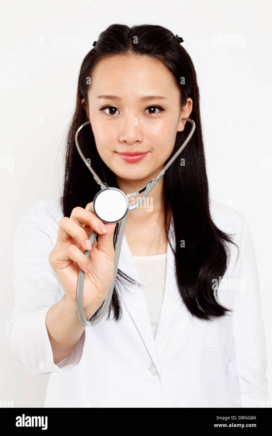 Female doctor takes stethoscope Stock Photo - Alamy