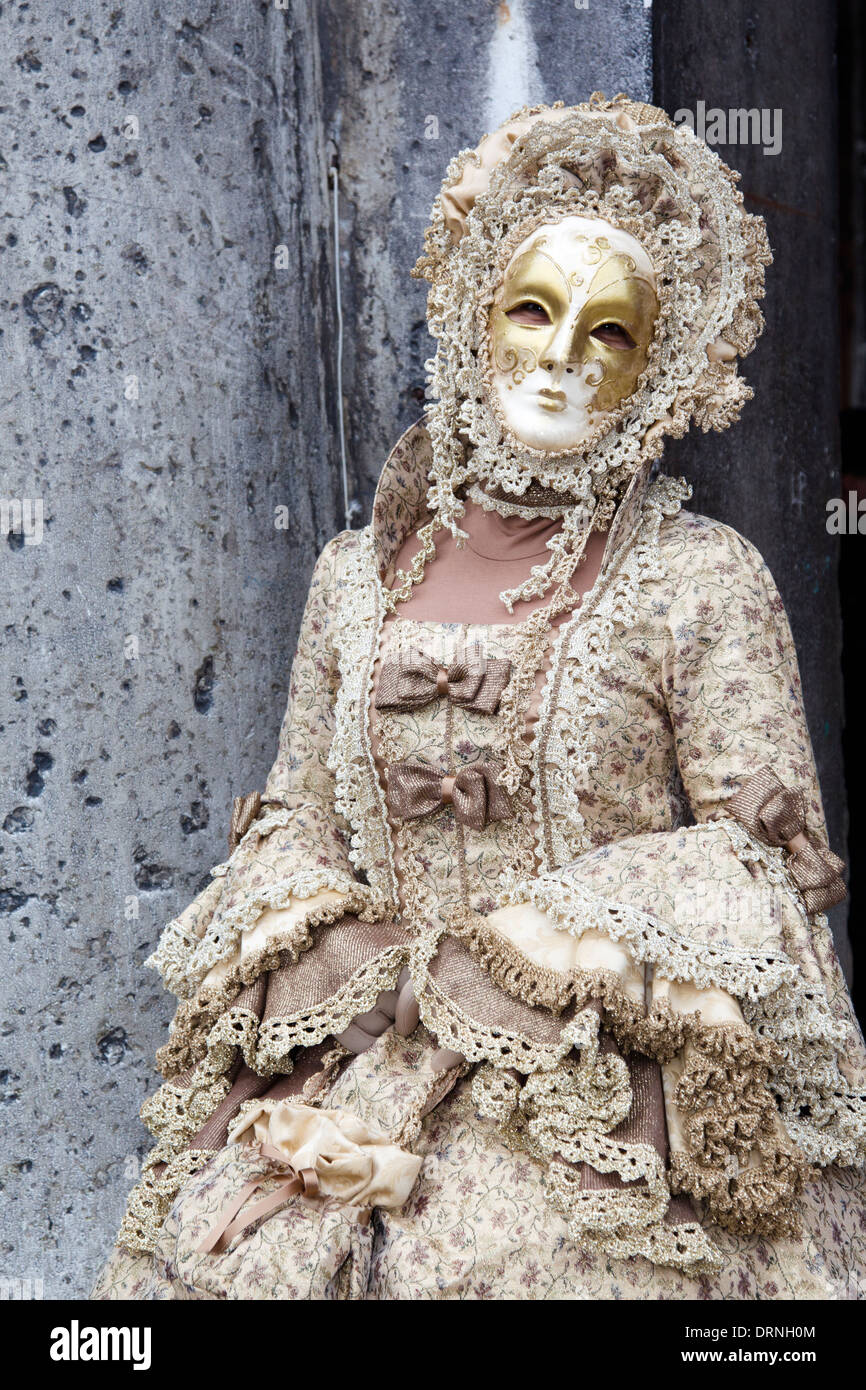 Costumed and masked attendee of the Venice Carnival poses for the ...
