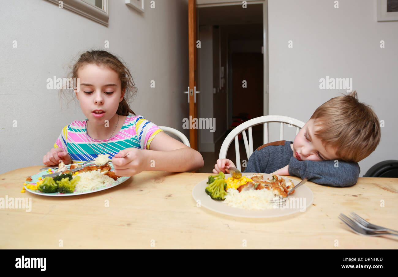 Children eating dinner Stock Photo - Alamy