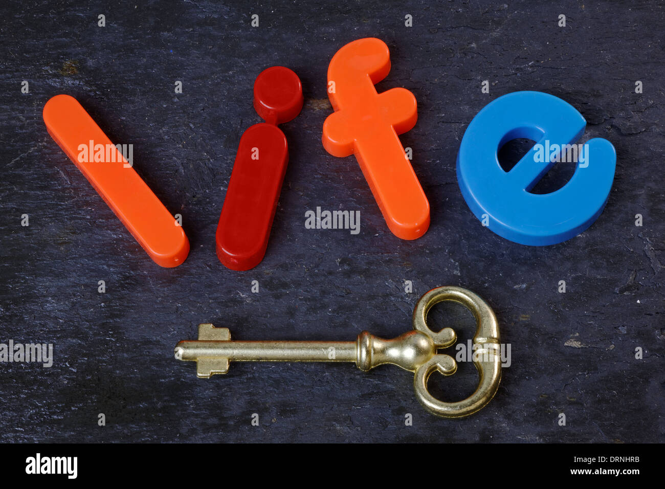 Antique key on a slate background with the word life in letters Stock ...