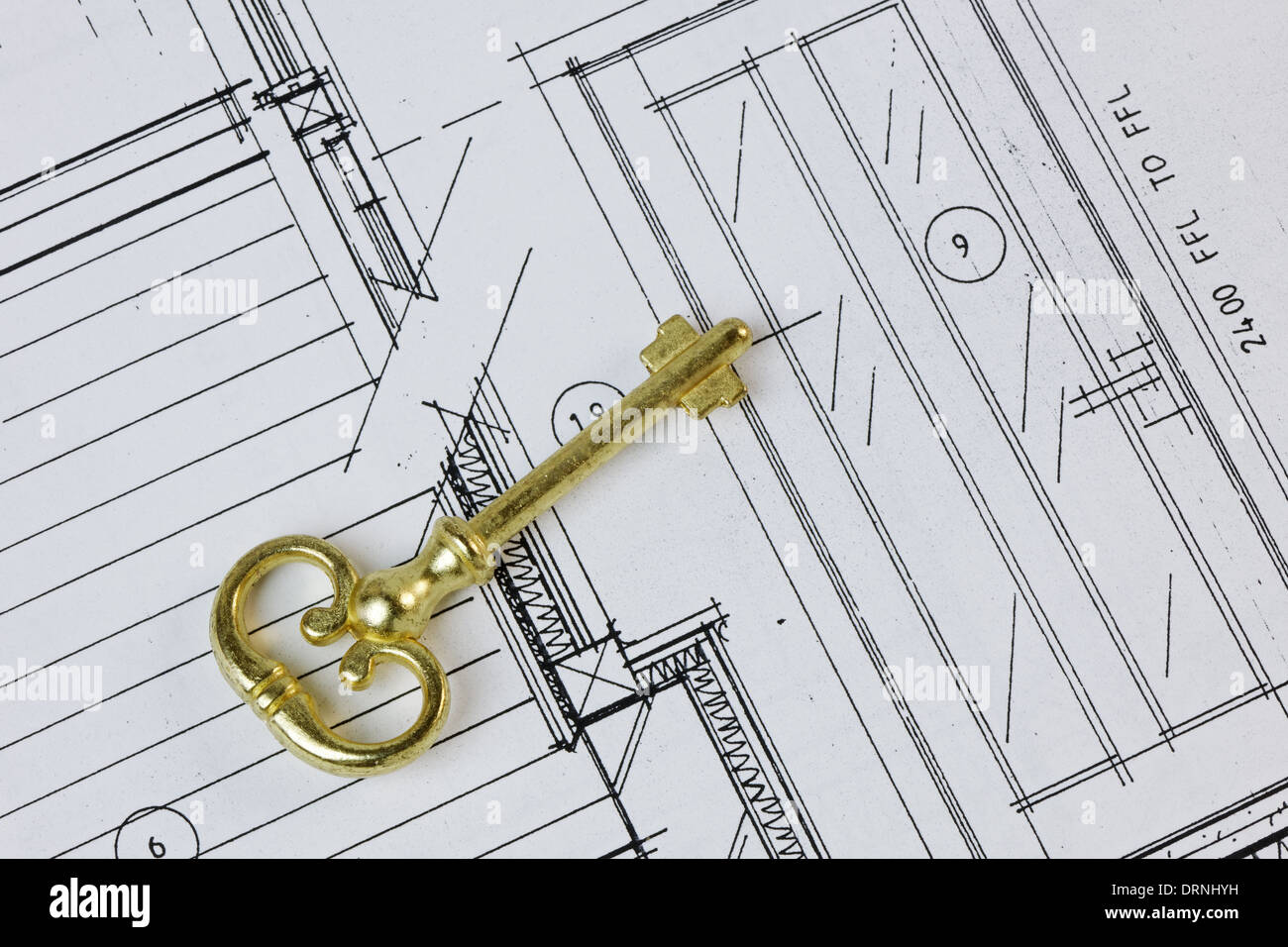 An antique key on a house plan. Ownership/design concept Stock Photo ...