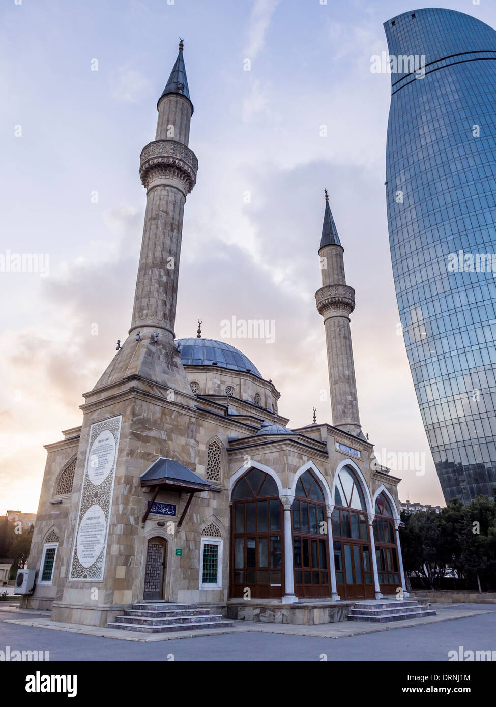 Sehidler Mescidi Mosque next to the Flame Towers in Baku, Azerbaijan ...