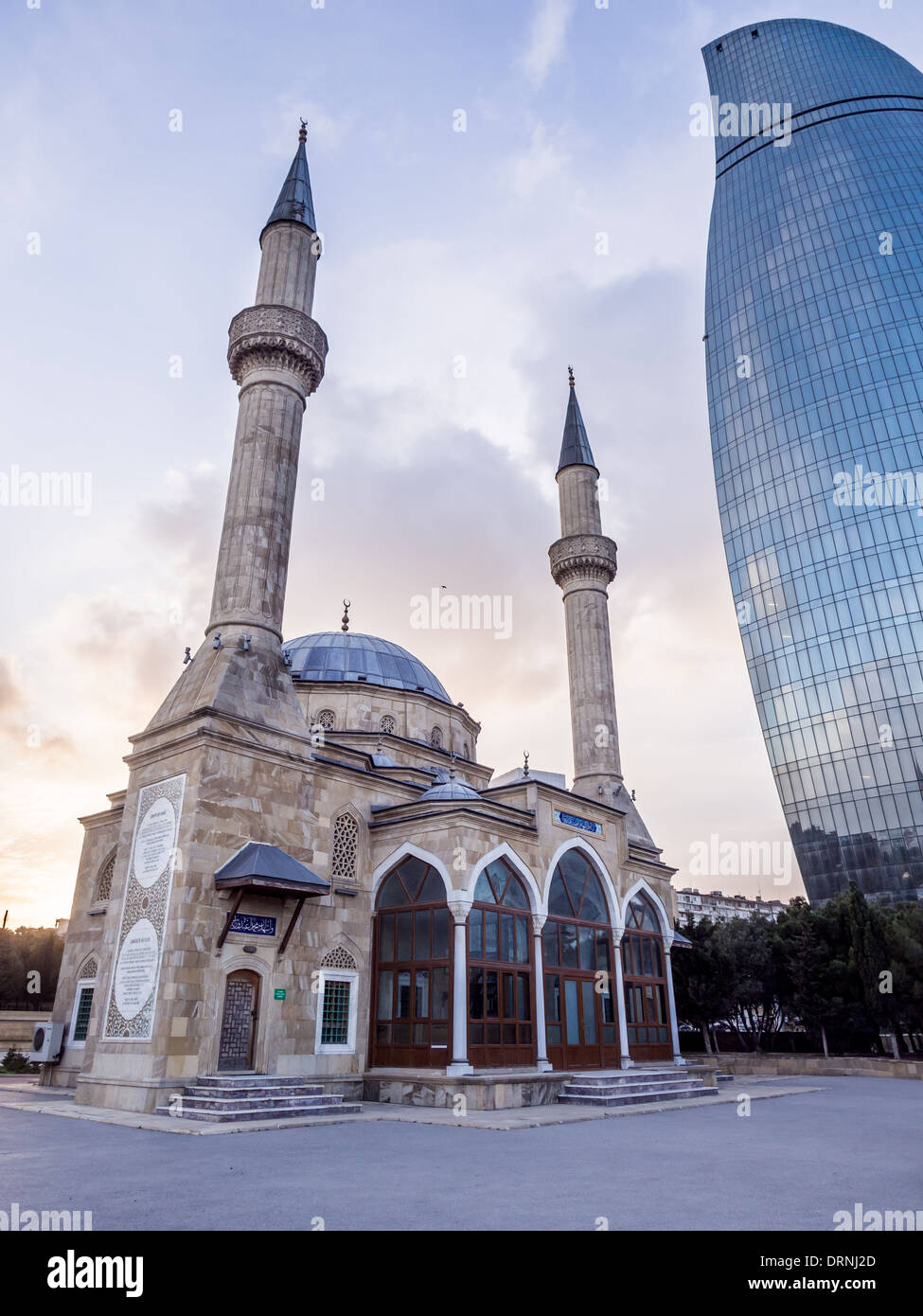 Sehidler Mescidi Mosque next to the Flame Towers in Baku, Azerbaijan ...