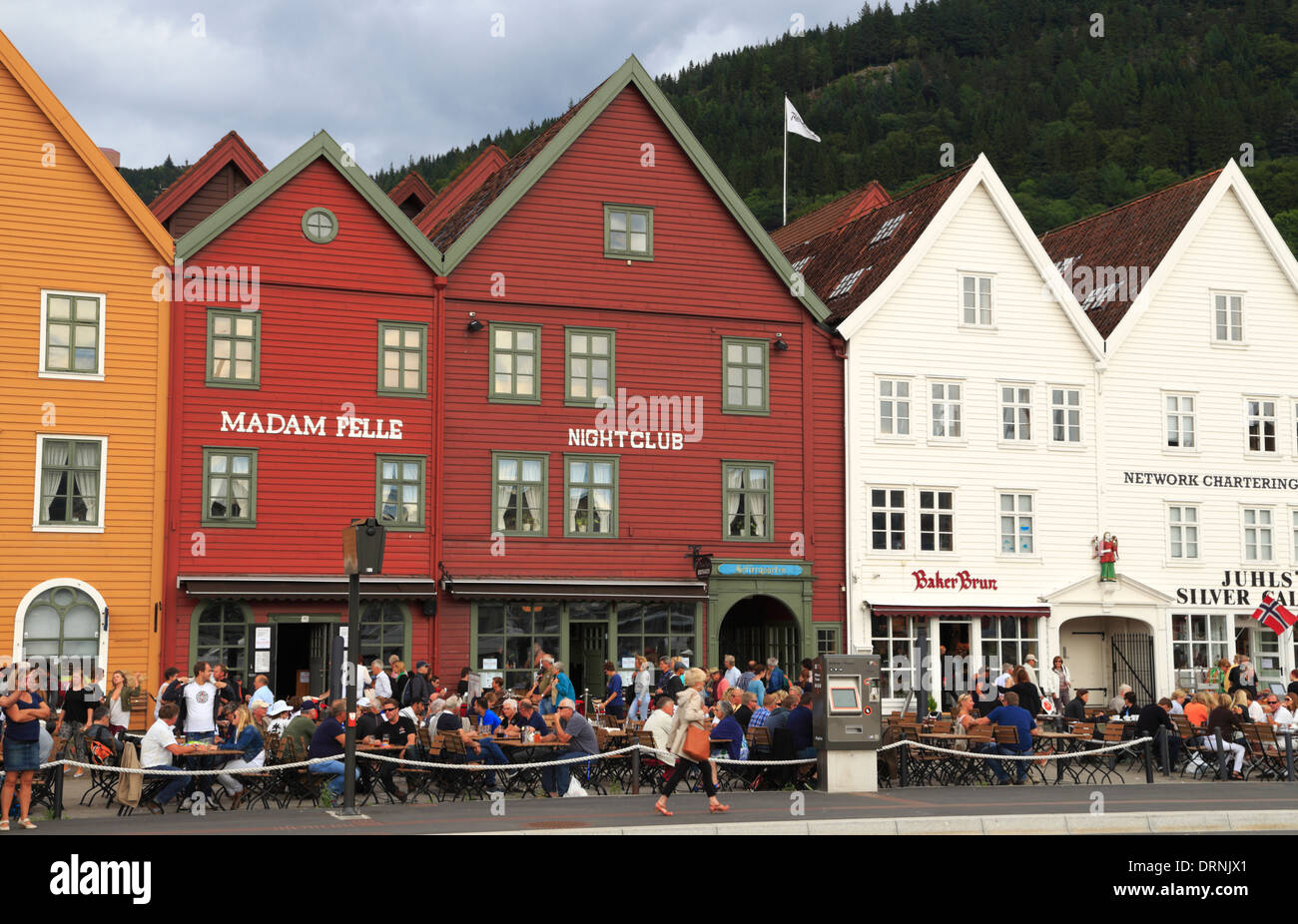 People sit at an outdoor cafe on the UNESCO World Heritage Site and ...