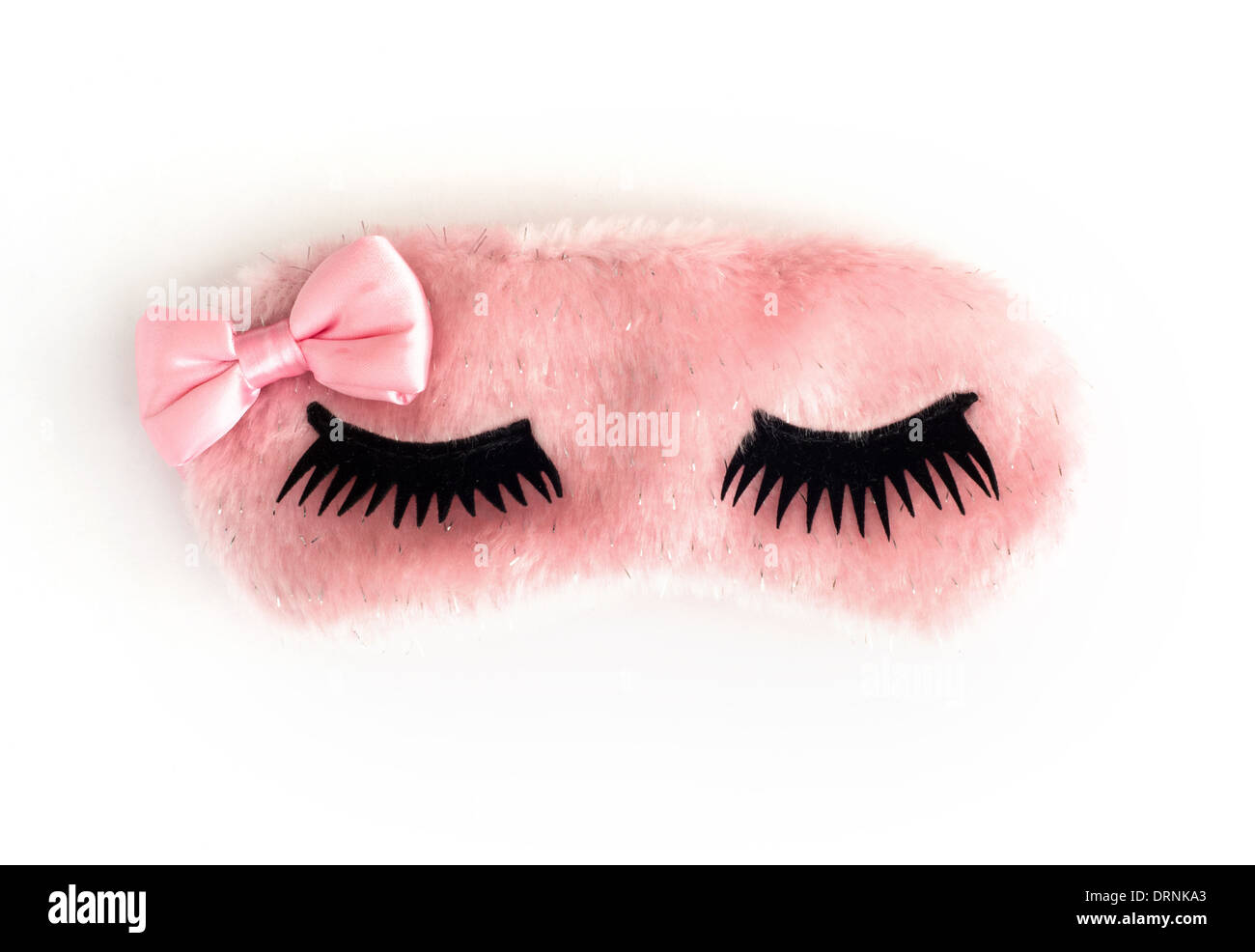 Pink sleeping mask on a white background Stock Photo - Alamy