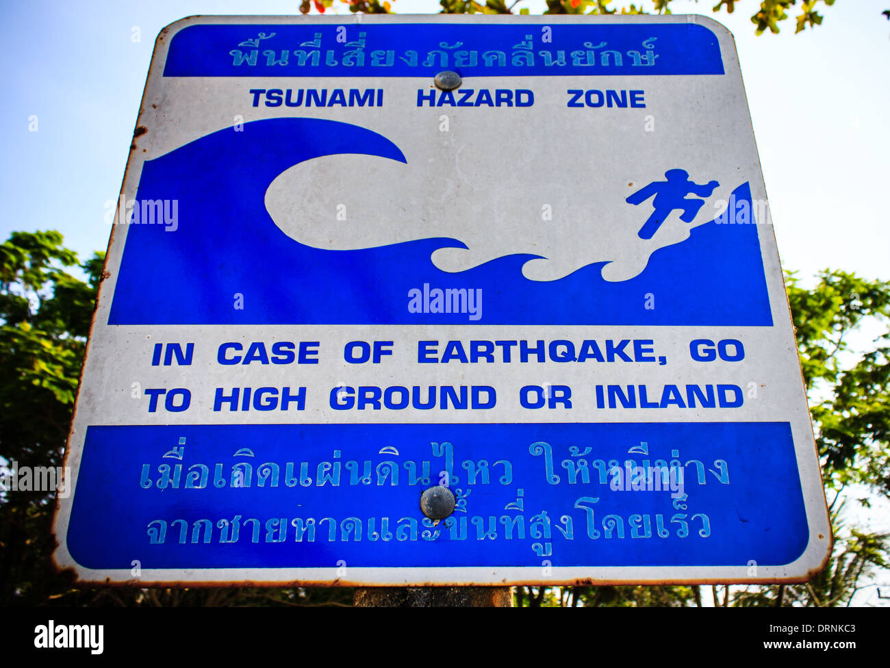 Tsunami Evacuation Sign near a beach in Thailand Stock Photo - Alamy