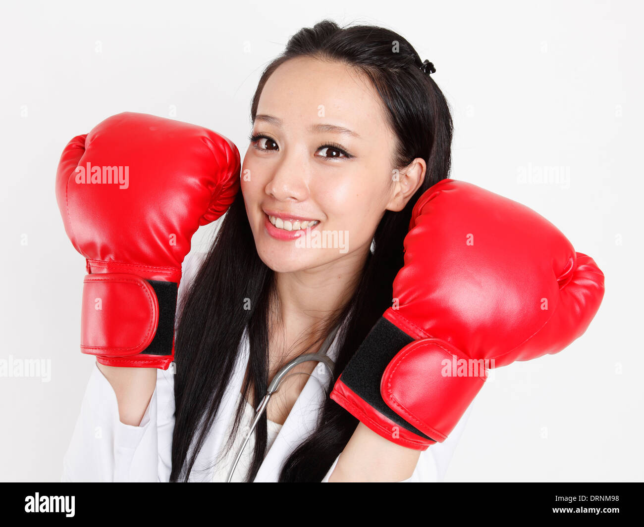 Female doctor plays boxing for exercise Stock Photo - Alamy