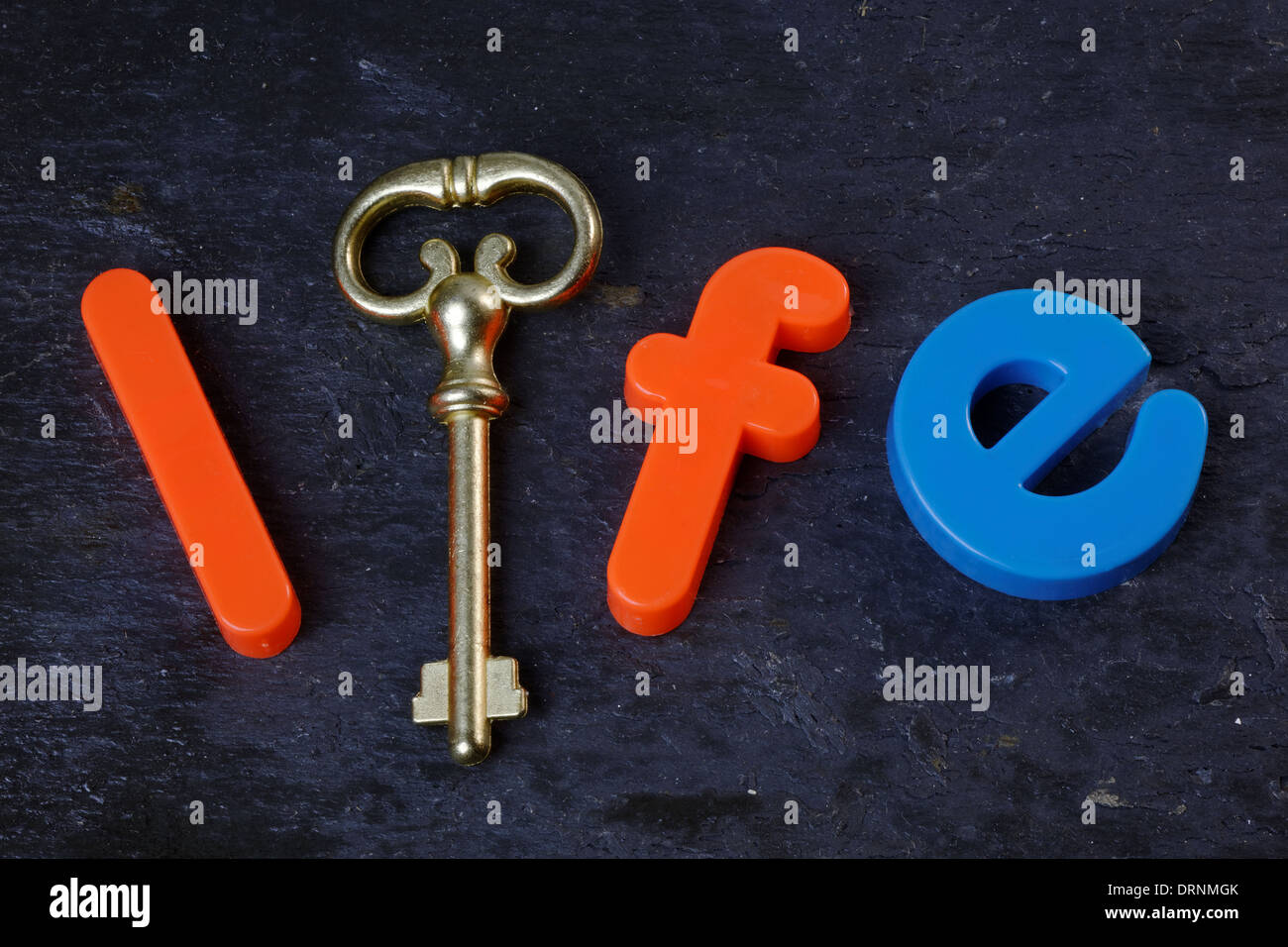 Antique key on a slate background with the word life in letters Stock ...