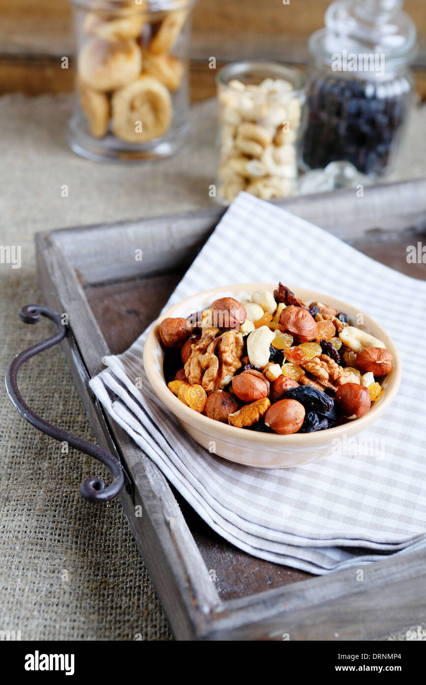 Assorted nuts in ceramic bowl on a tray, food closeup Stock Photo - Alamy
