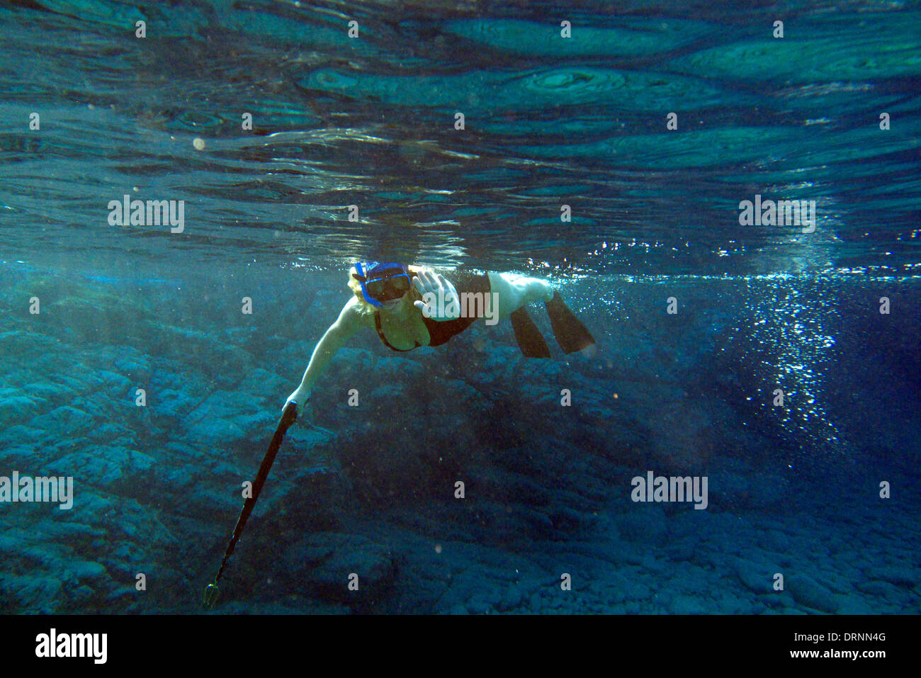 greece cyclades sikinos a woman spearfishing Stock Photo - Alamy