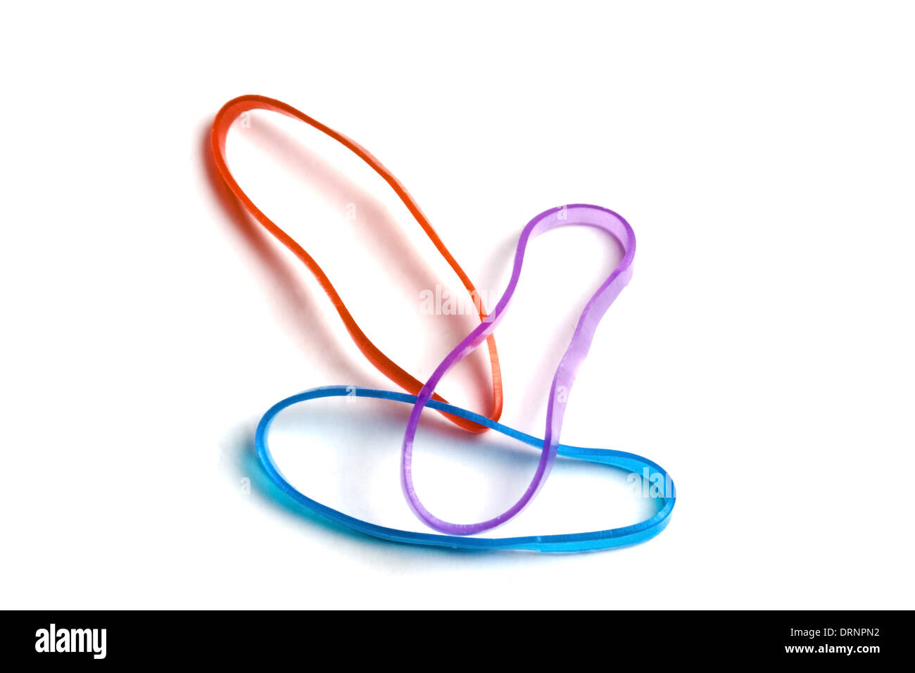Three colorful rubber bands Stock Photo - Alamy