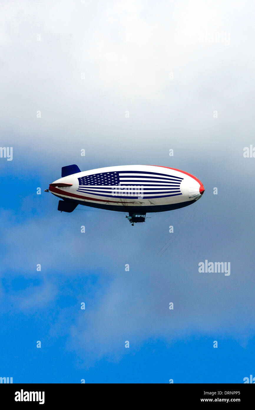 An American Flag toting airship flying around the blue skies of Florida ...