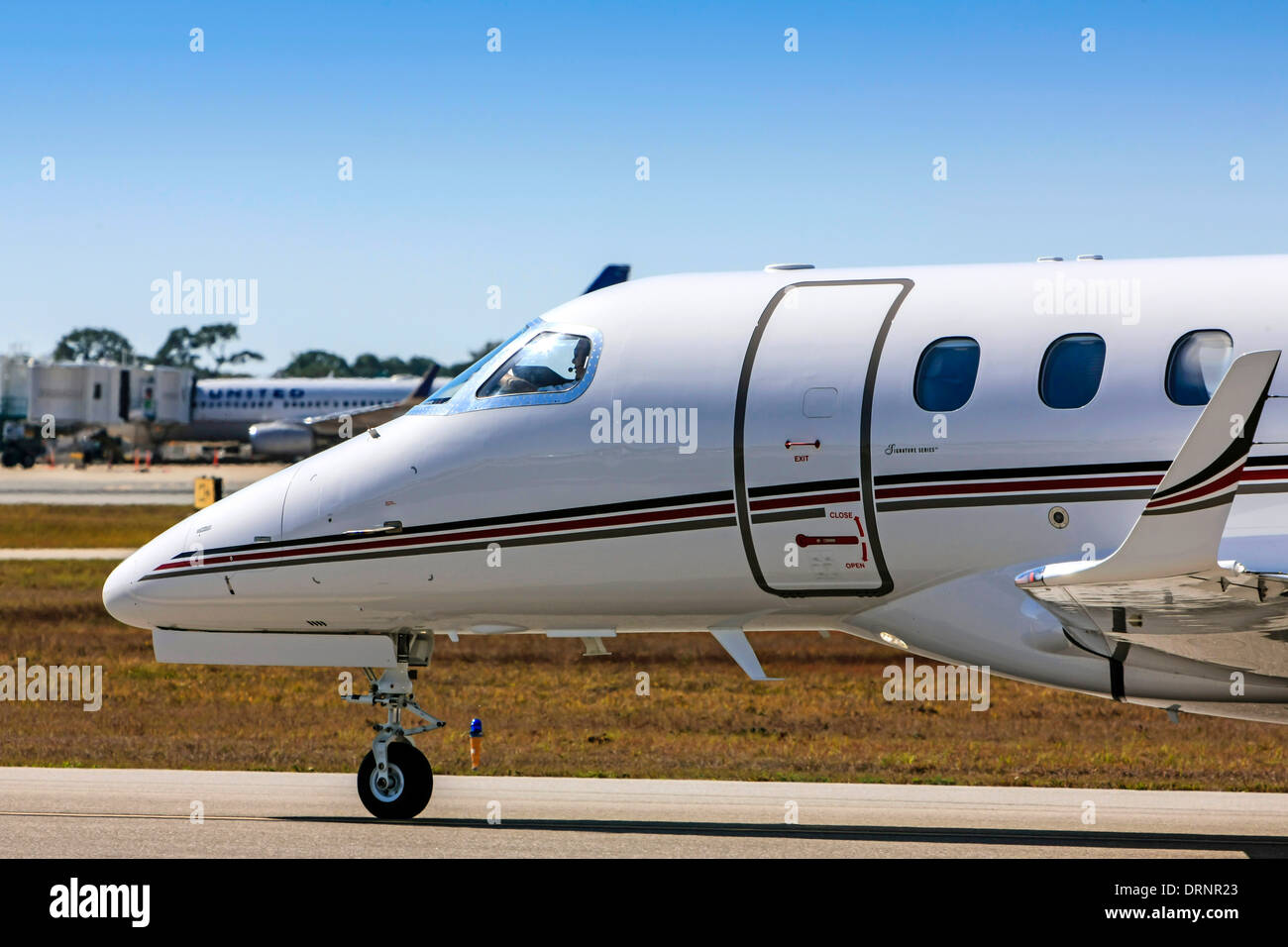 A Embraer Phenom 300 private Jet at Sarasota Airport FL Stock Photo - Alamy