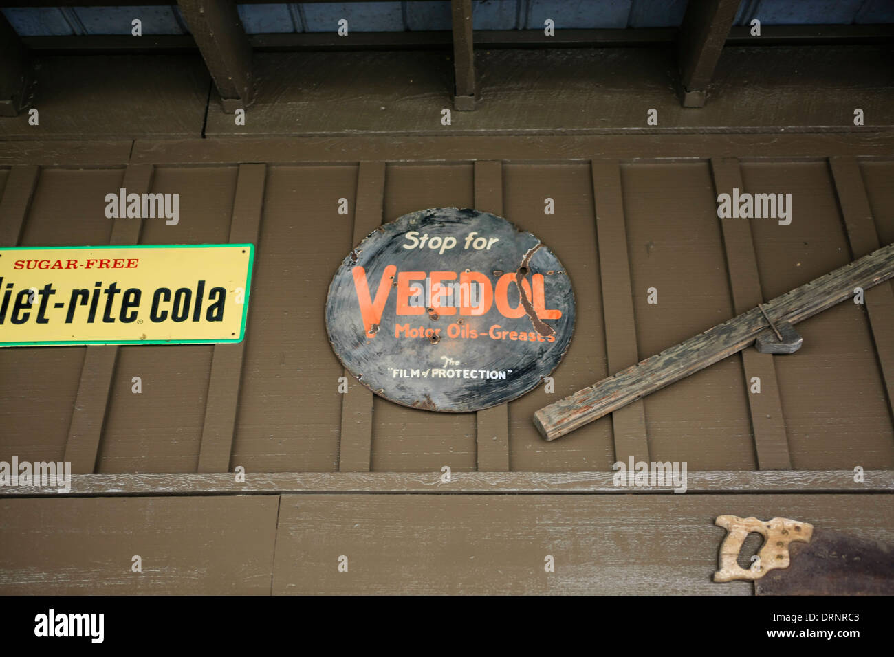 Old fashioned sign for Diet-rite-cola and Veedol Stock Photo - Alamy
