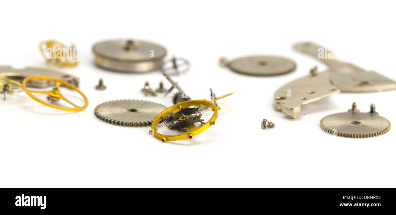 Clockwork details on a white paper Stock Photo - Alamy