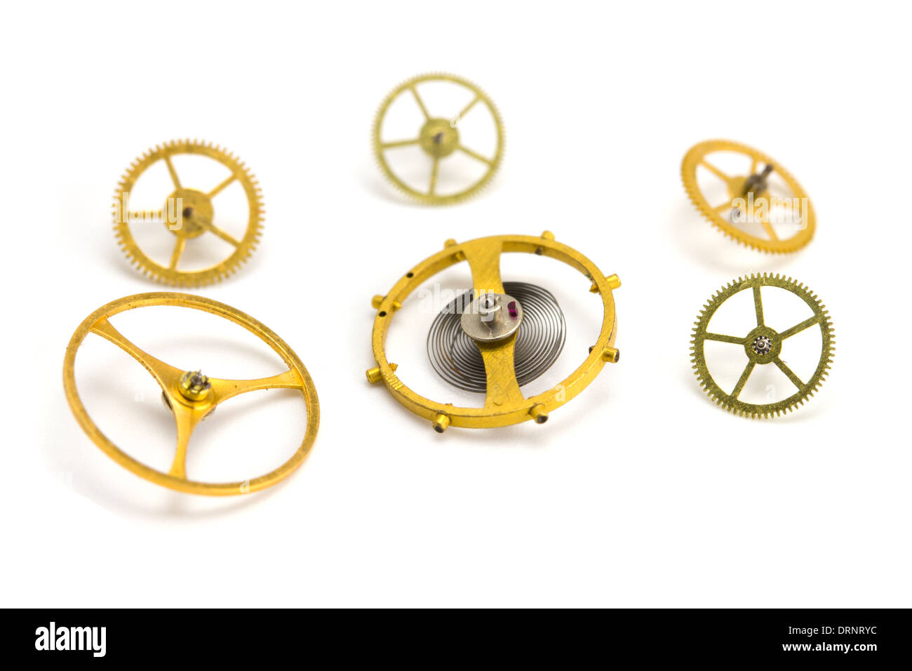 Clockwork details on a white paper Stock Photo - Alamy